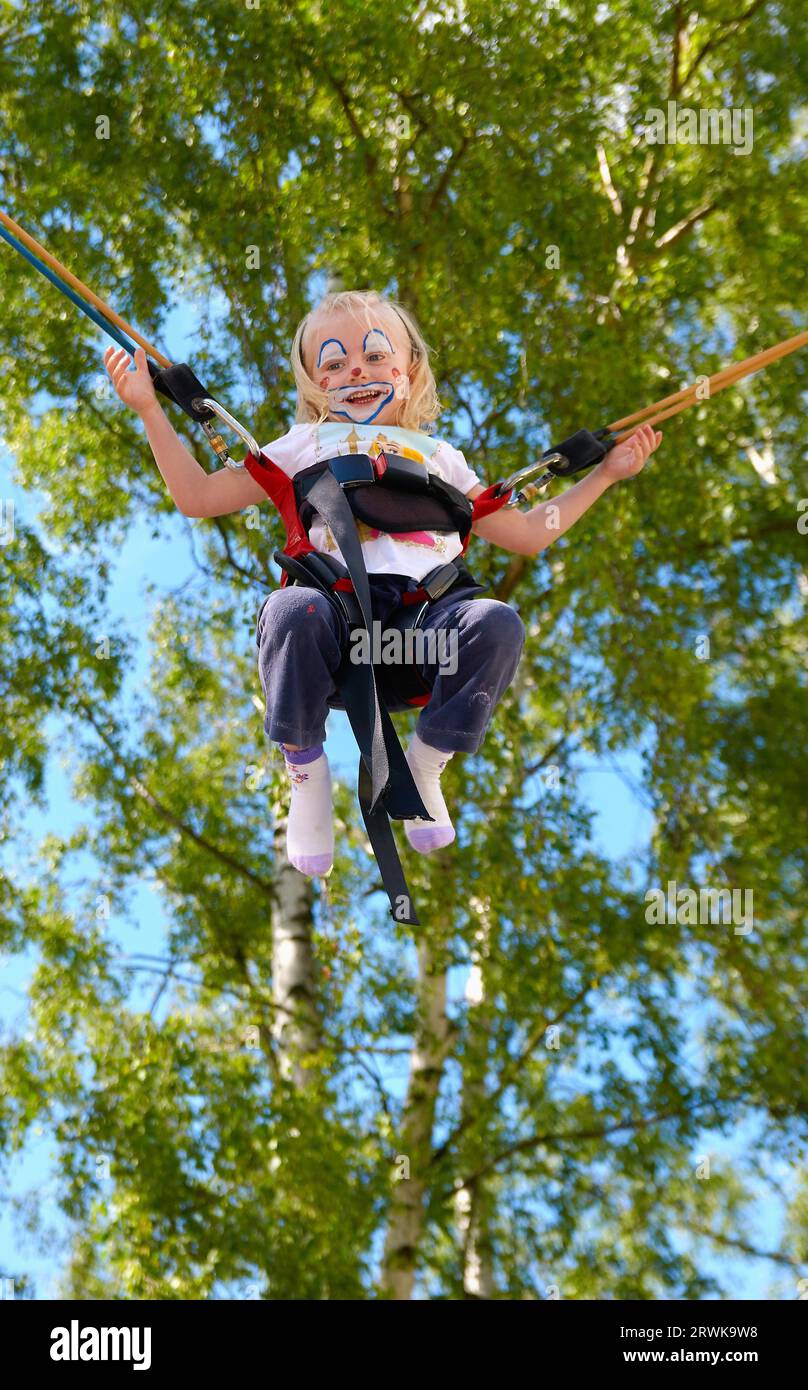 Child clown jumping Stock Photo - Alamy