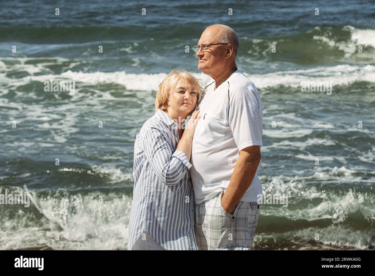 Portrait of a happy elderly couple by the sea. Medium plan Stock Photo - Alamy