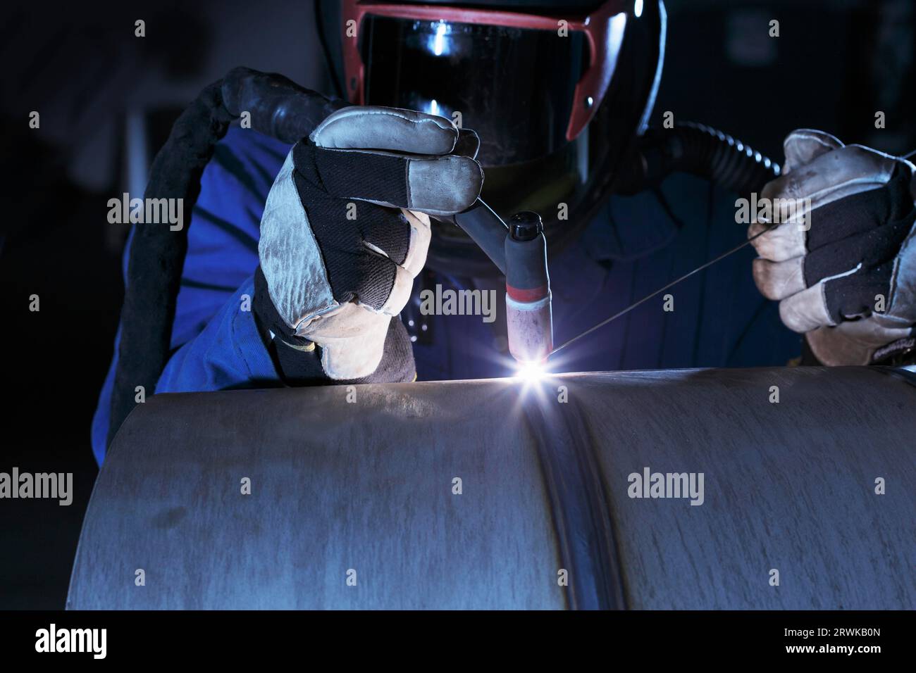 Industrial welder welding with tig torch Stock Photo - Alamy