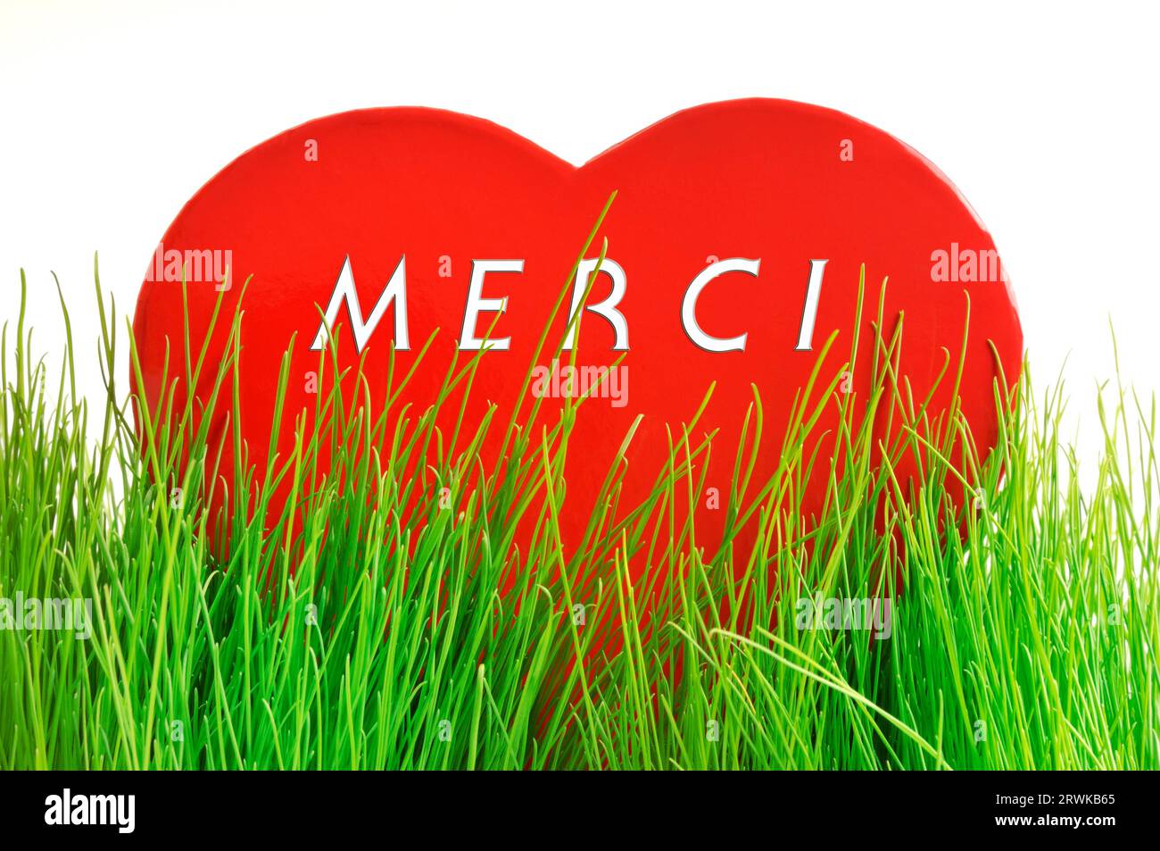Heart with the inscription Merci Stock Photo - Alamy