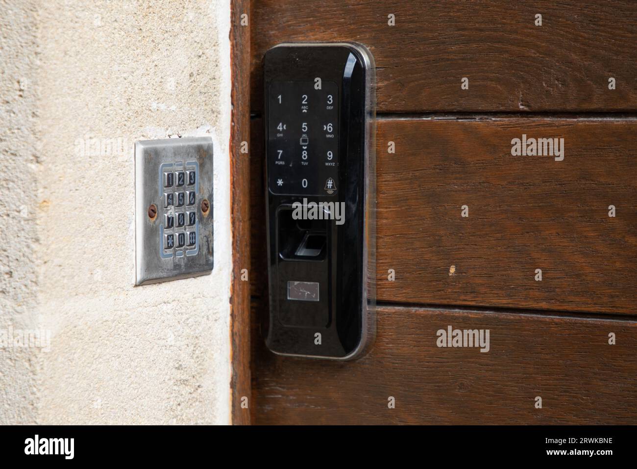 Ring surveillance video and numeric keypad password on old wooden door ...