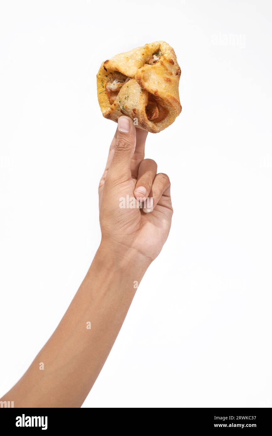 A human hand holding a side dish with a white background Stock Photo ...