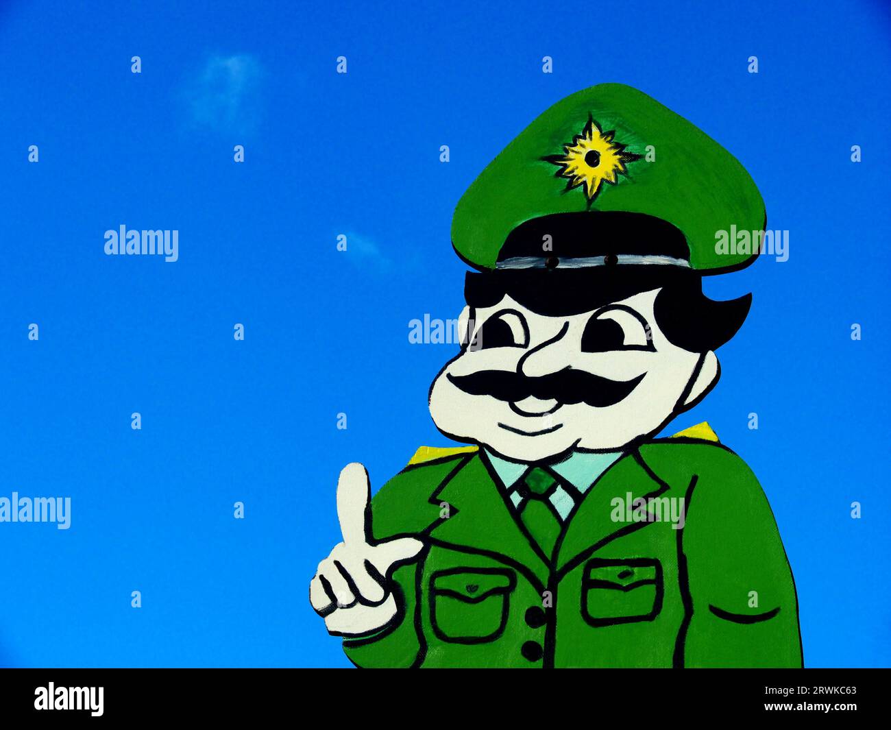 Policeman, plywood figure, as a reminder for drivers, background blue ...