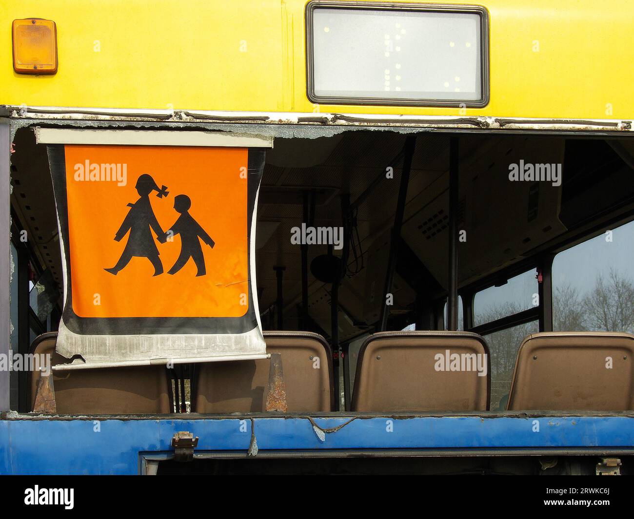 Discarded and cannibalised former school bus, rear view, cut-out Stock ...
