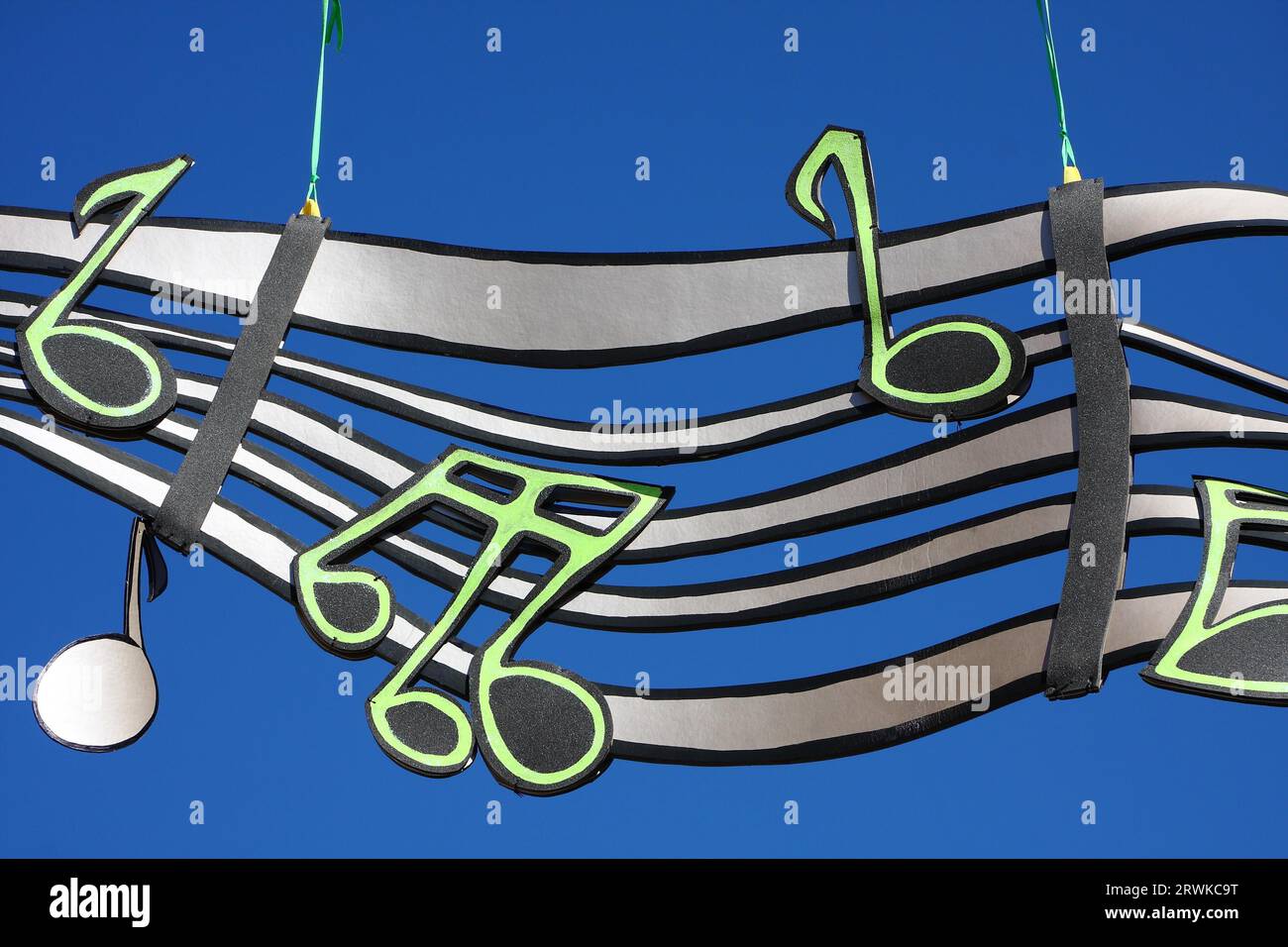 Suspended scale with notes, background blue sky Stock Photo - Alamy