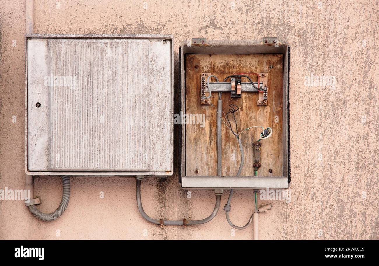 Two boxes for electrical control, one open, the other closed ...