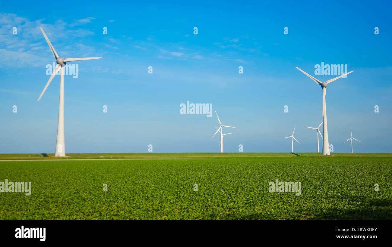 wind turbines in the green agricultural grass field Stock Photo - Alamy