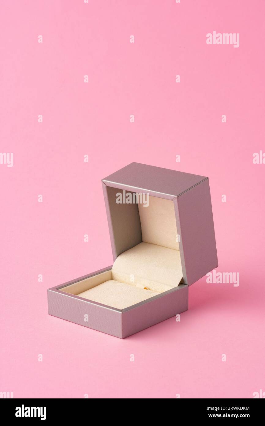 Small jewelry box on pink studio background Stock Photo - Alamy