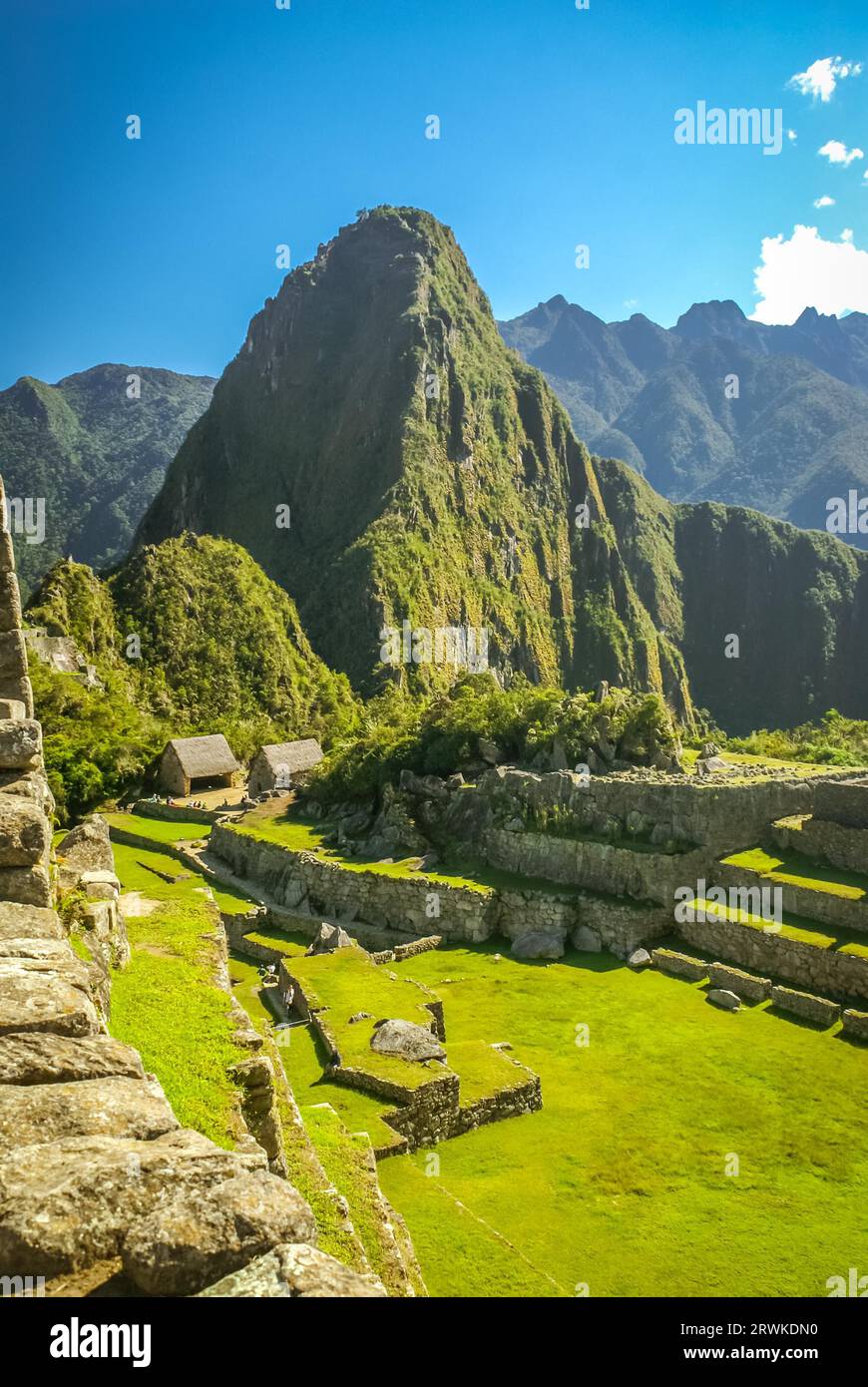 High mountains surrounding old stone settlement in Cuzco valley in Peru ...