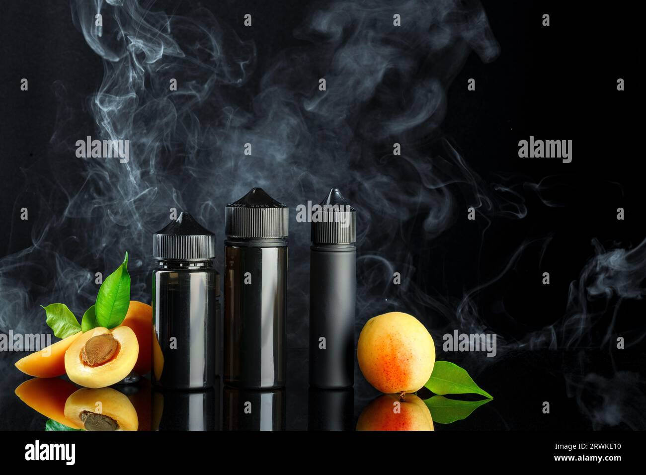 Vape and smoking liquid with fruit against black background with smoke ...