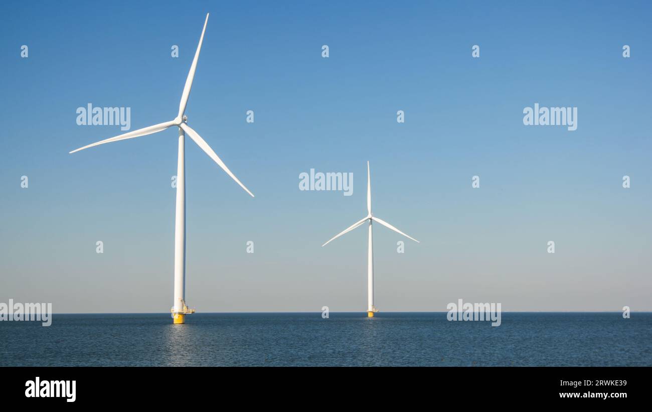 Wind Farm. Windmill farm in the ocean. Offshore wind turbines in the ...