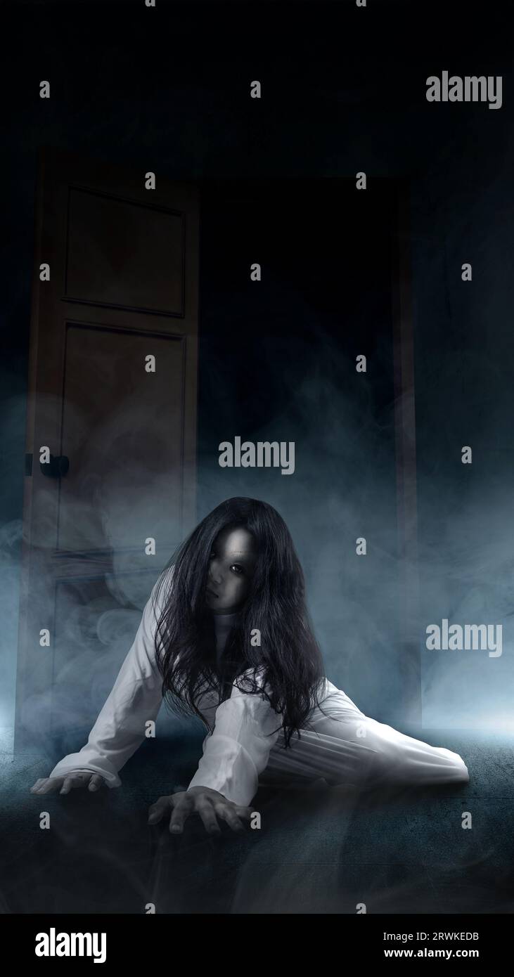 A scary ghost woman crawls on the floor with white smoke background ...