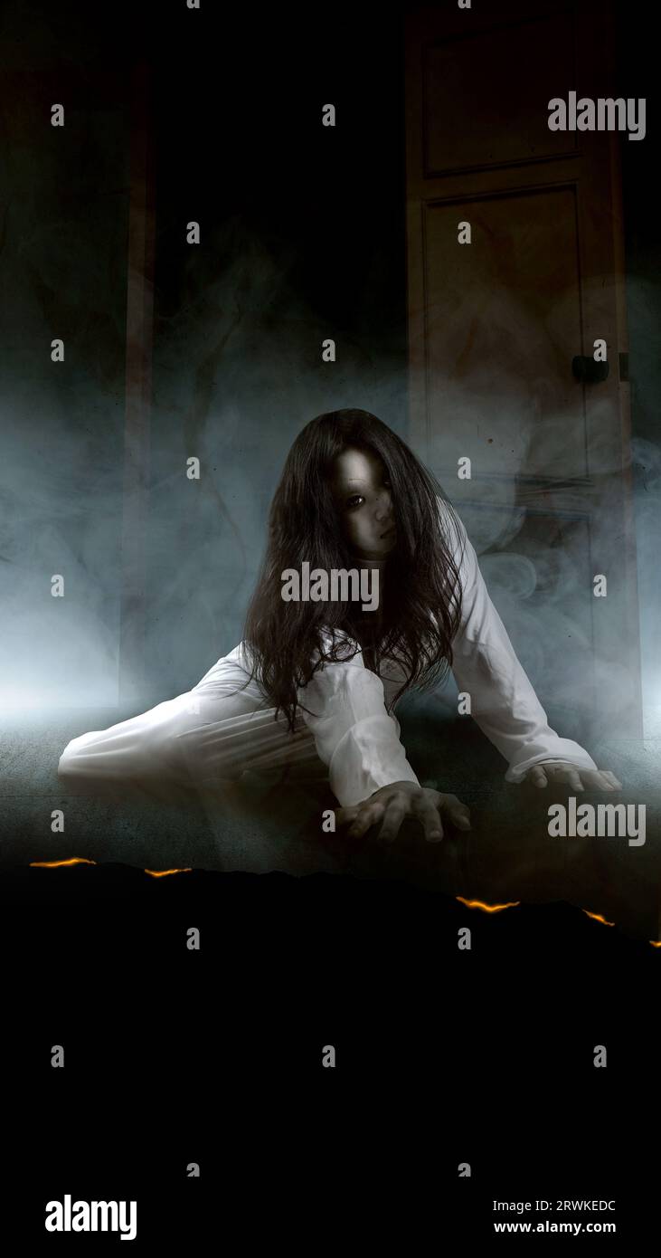 A scary ghost woman crawls on the floor with white smoke background ...