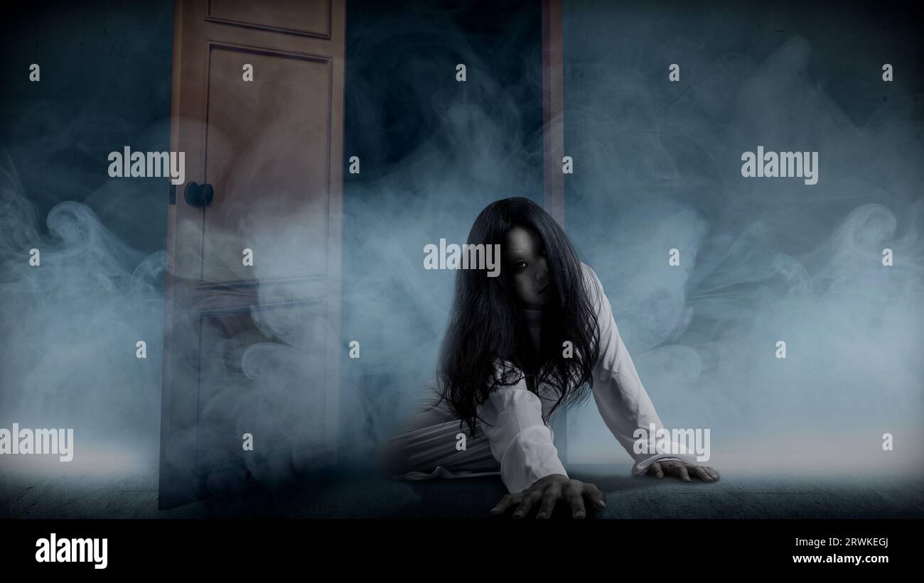 A scary ghost woman crawls on the floor with white smoke background ...