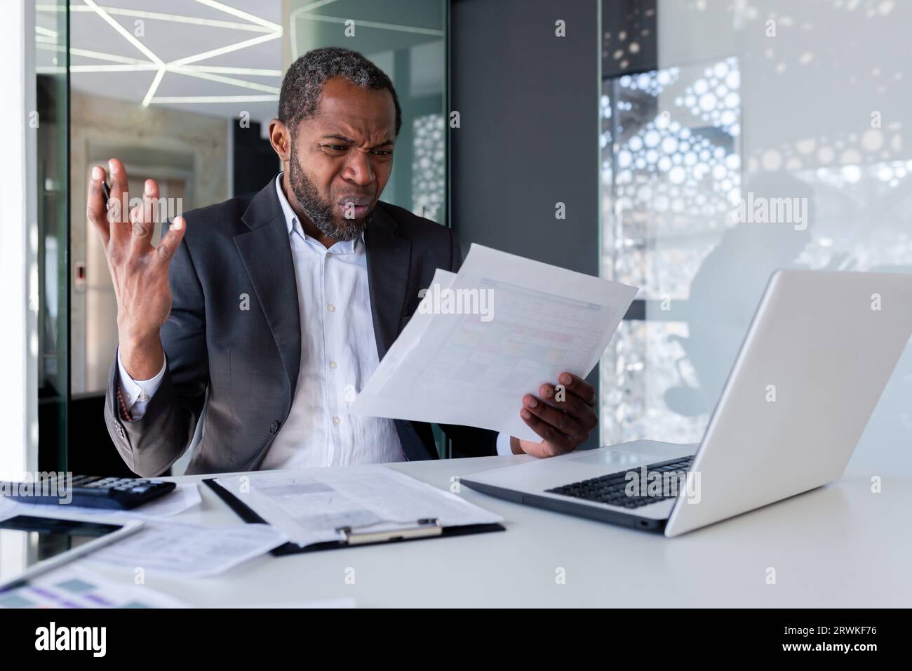 Frustrated and angry financier at workplace inside office, angry boss ...