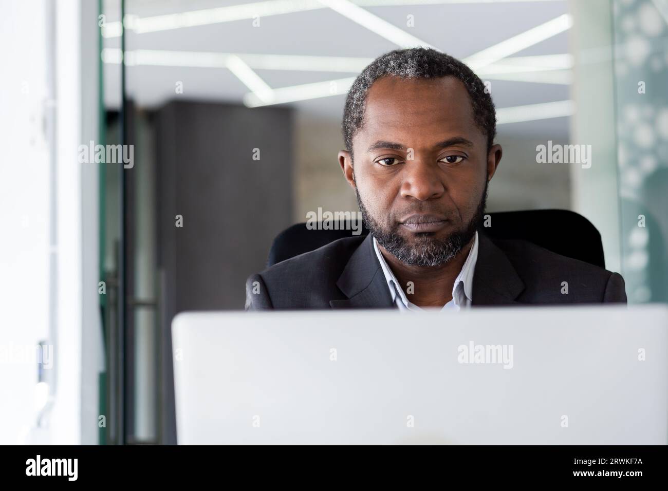 Serious thinking boss businessman close up, african american man ...