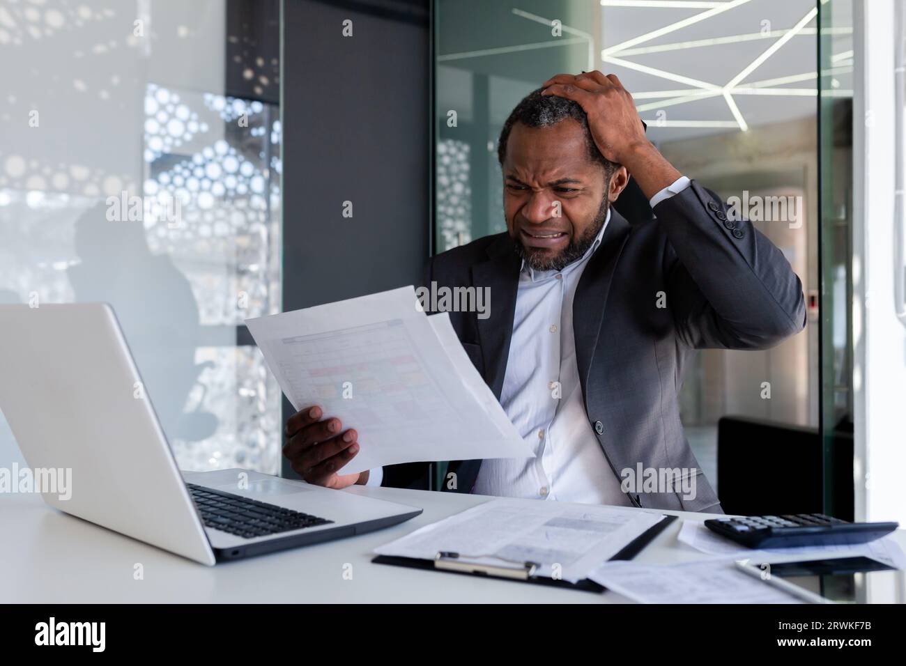 Frustrated and angry financier at workplace inside office, angry boss ...