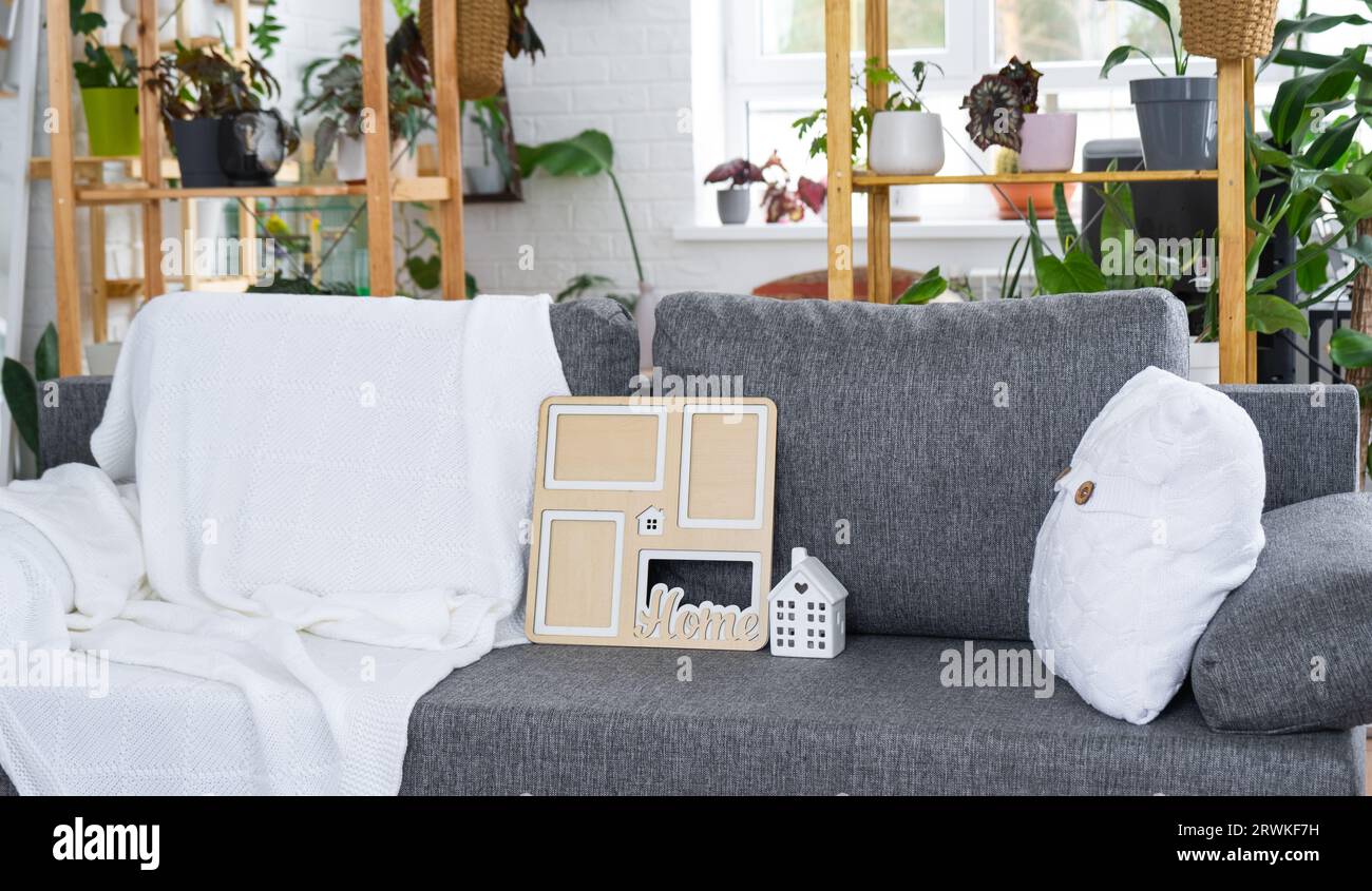 Key to home with keychain and mock up frame miniature of house on gray ...