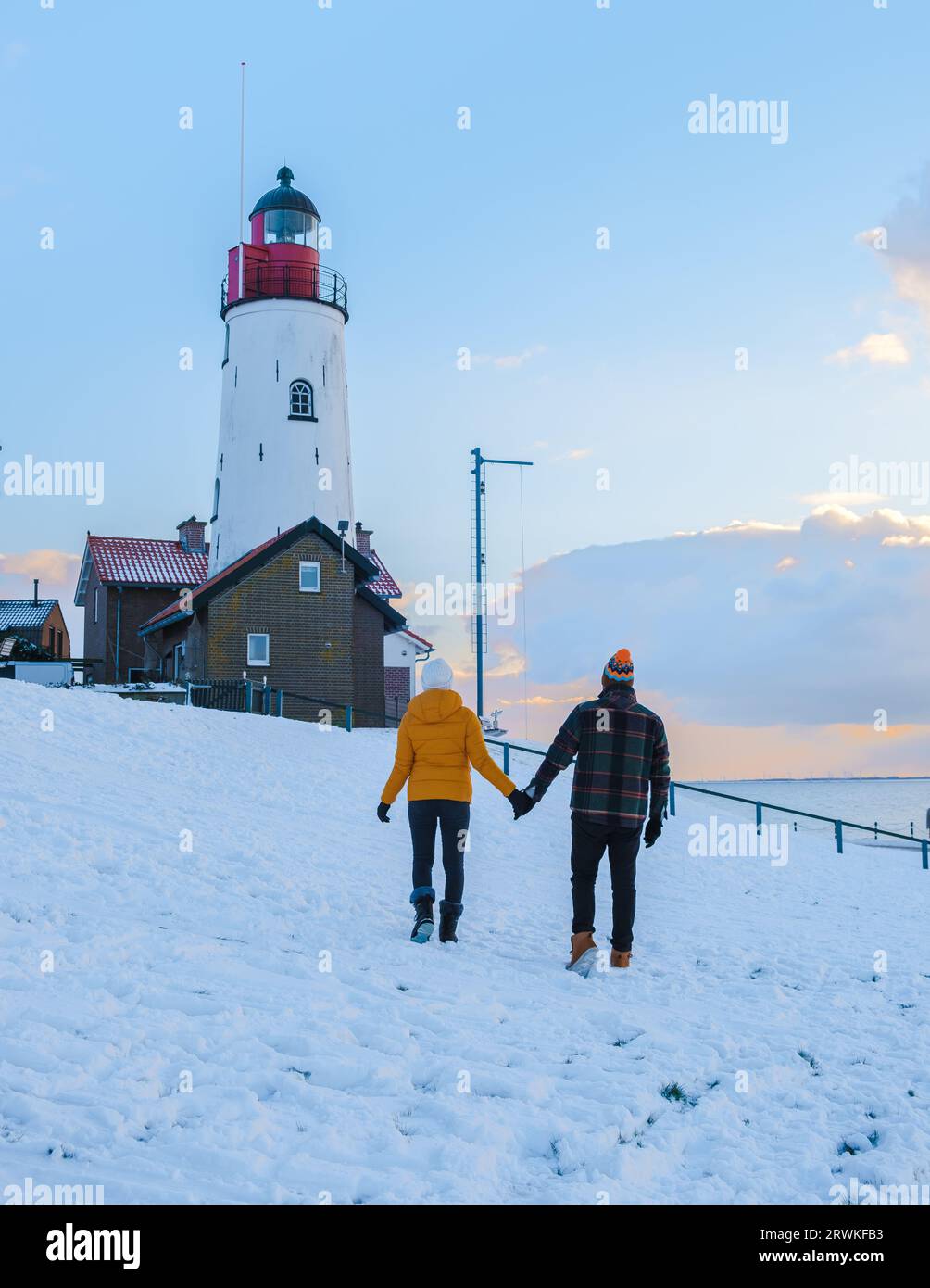 Lighthouse of Urk Netherlands during winter with snow in the ...