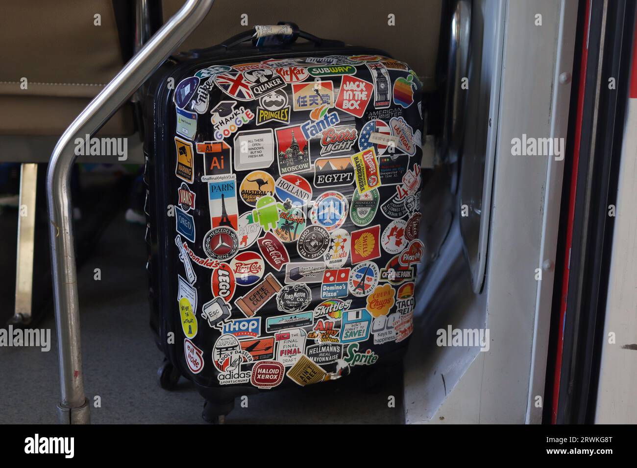Passenger suitcases containing stickers are placed in the train cabin ...