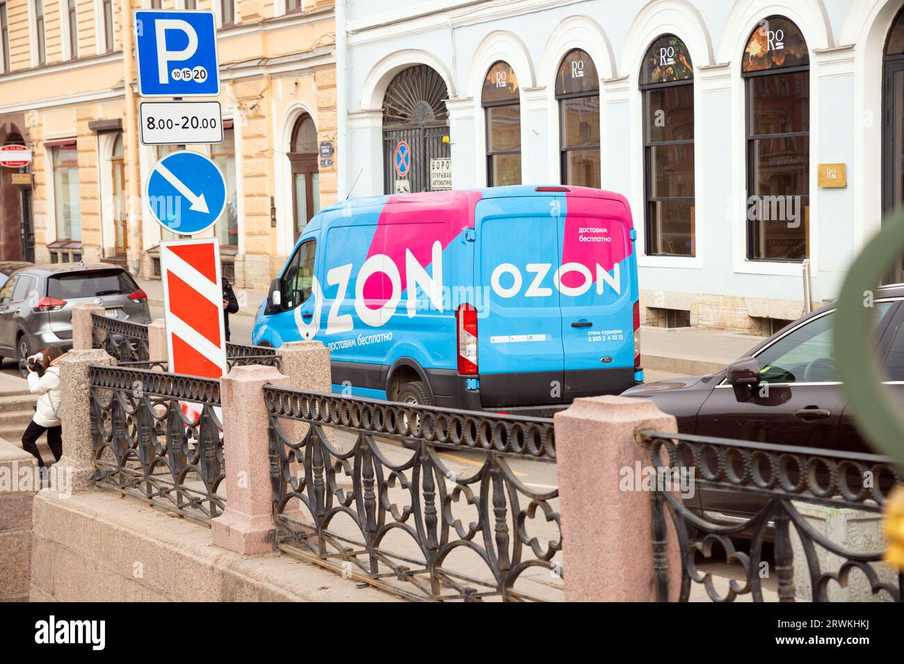 Ozon logo sign on mini van truck on street of European city. branded ...
