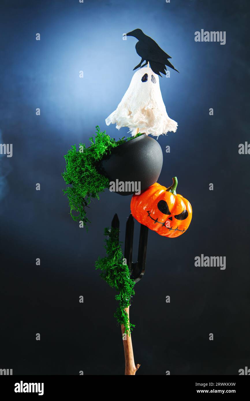 Balancing composition - pitchfork, jack-o'-lantern, ghost and raven ...