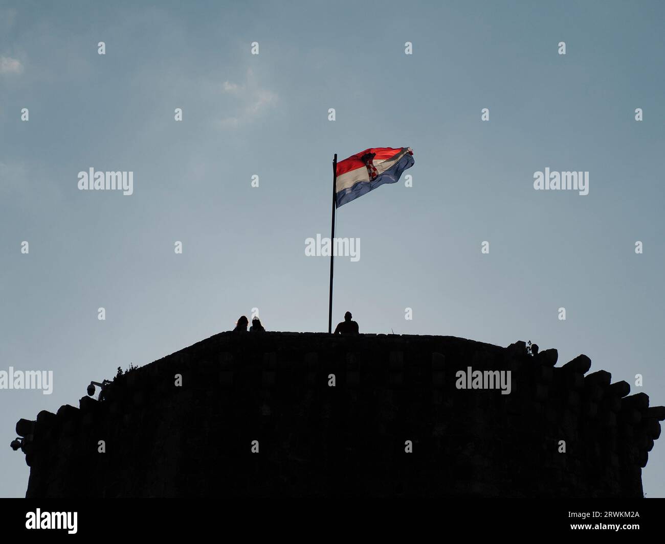 Croatian waving flag on castle of Trogir medieval town in Dalmatia ...