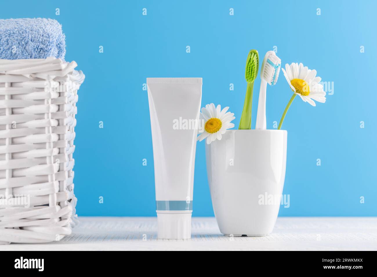 A clean and refreshing image featuring toothpaste and toothbrushes ...