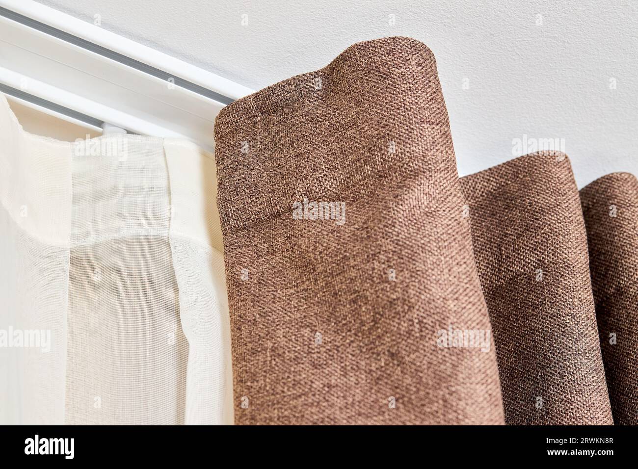 Ceiling cornice with drapes and white curtain or tulle. Interior ...