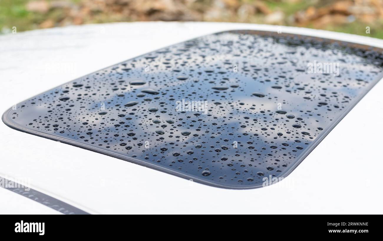 Rain drops on a car roof and glass sunroof hi-res stock photography and ...