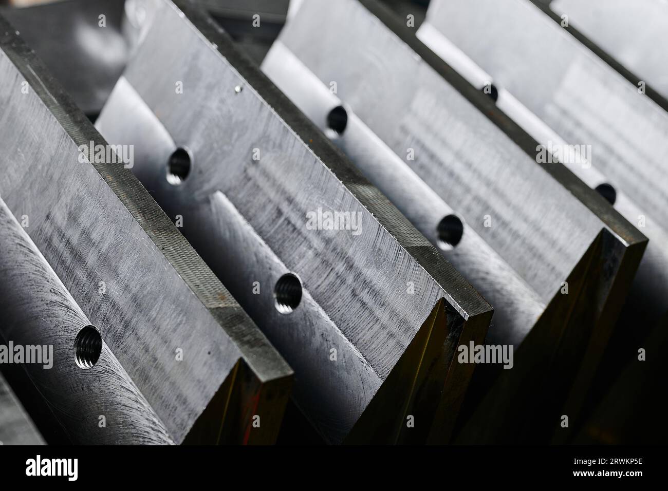 Processed metal plates with ground edges in warehouse Stock Photo - Alamy
