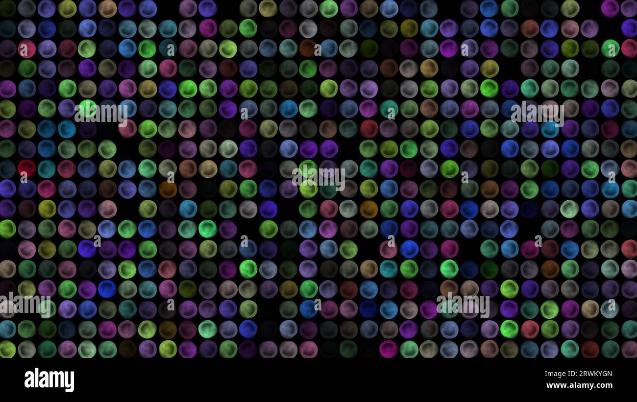 Colored flashing rotating plasticine circles on black bg. Abstract ...