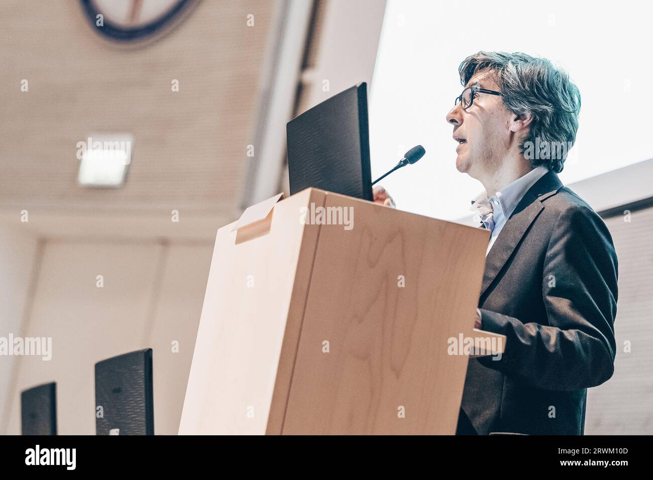 Speaker giving talk on podium at Business Conference. Business and ...