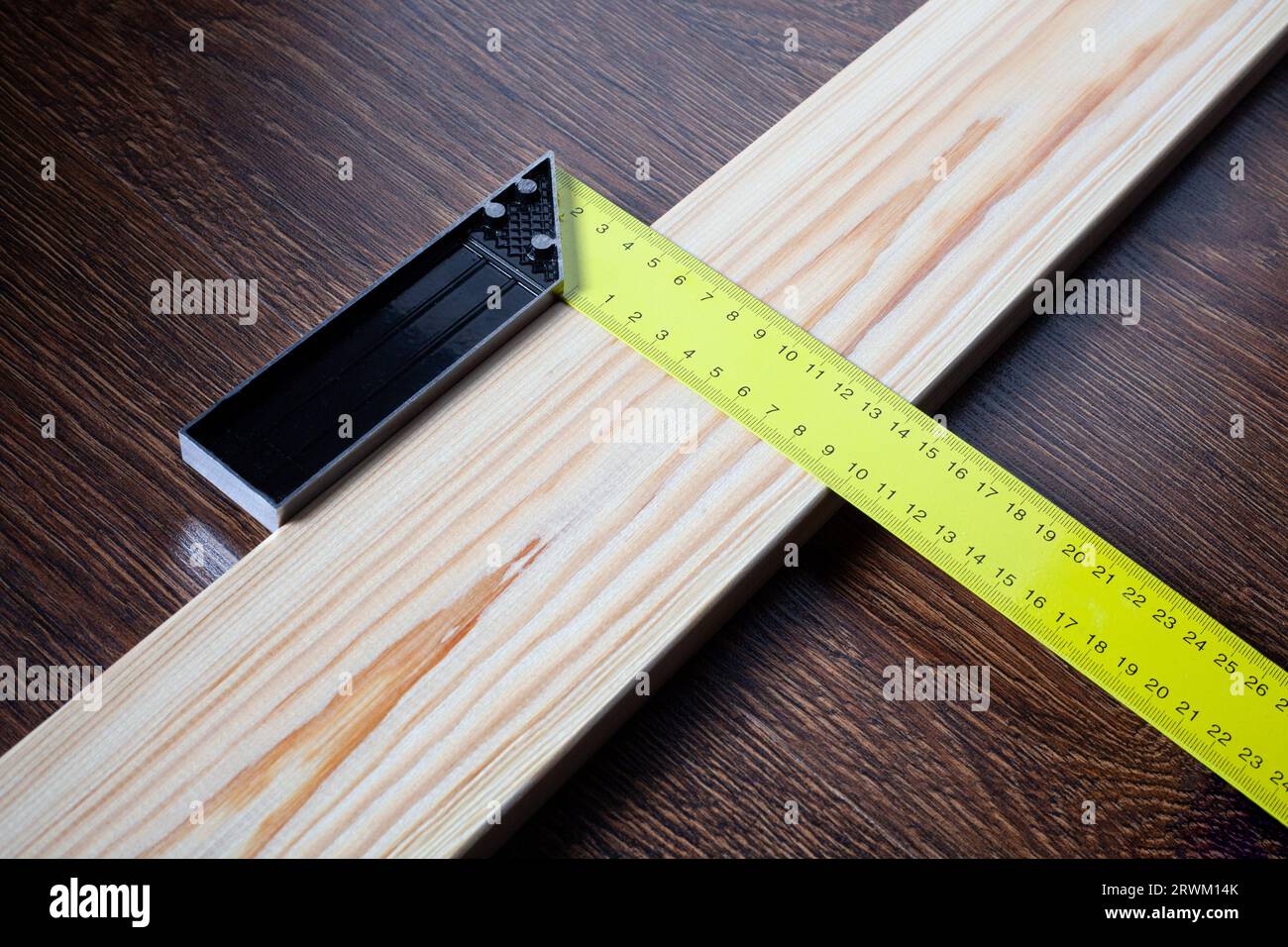 Square ruler and pencil for measuring on wooden board. construction ...