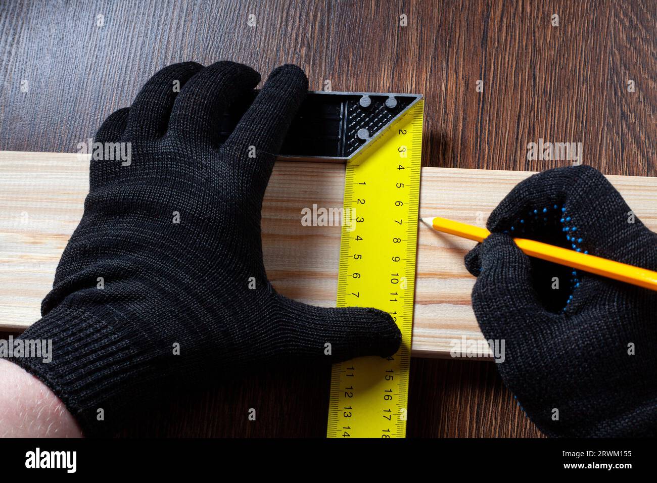 Carpenter using square ruler hi-res stock photography and images - Alamy