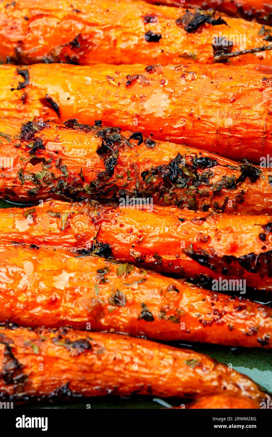 Roasted whole carrots, healthy root vegetables. Food background Stock ...