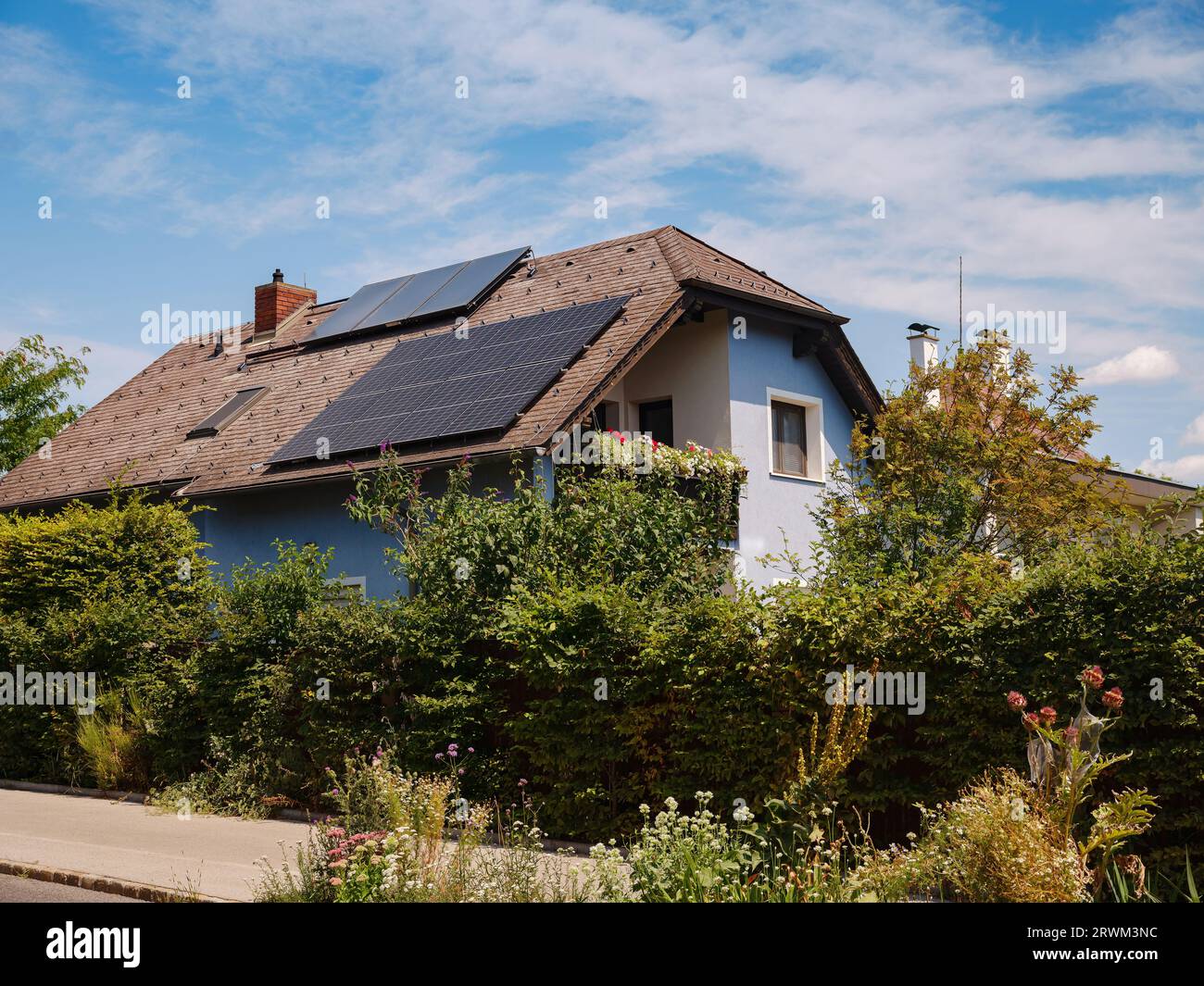 Solar photovoltaic panels on house roof. Modern country house with self ...