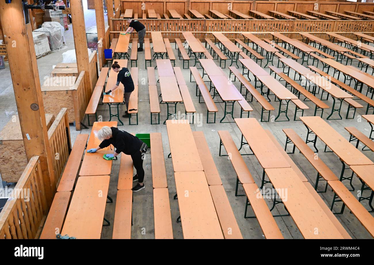Stuttgart, Germany. 20th Sep, 2023. Employees in a festival tent clean ...