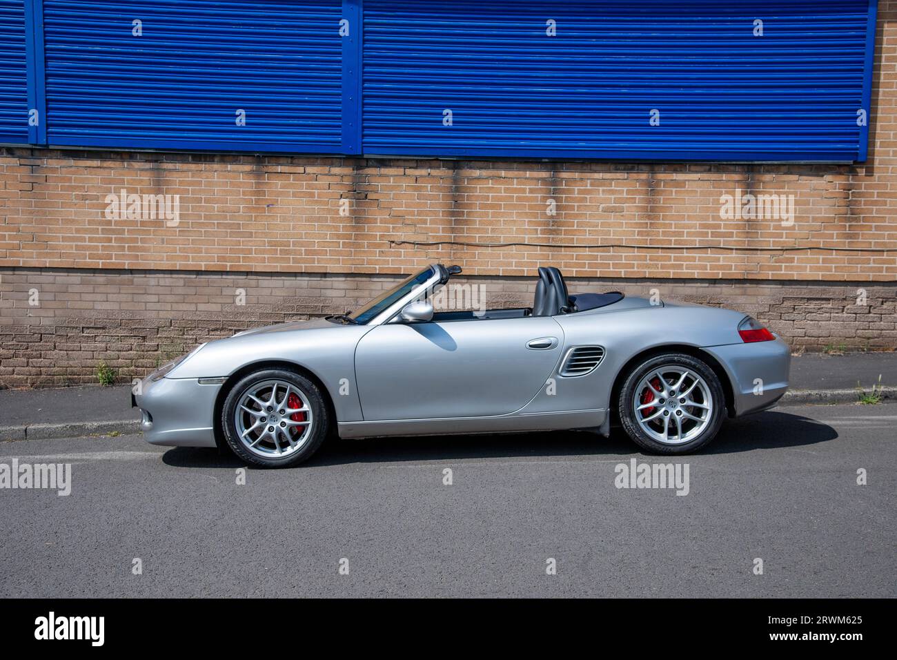 Porsche Boxter parked on an urban side street Stock Photo - Alamy