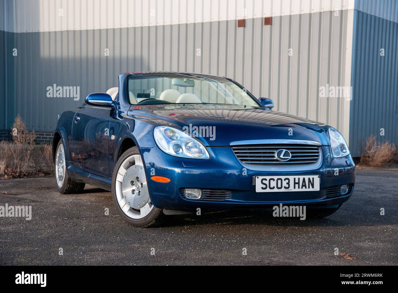 Blue Lexus SC convertible parked in an urban setting Stock Photo - Alamy