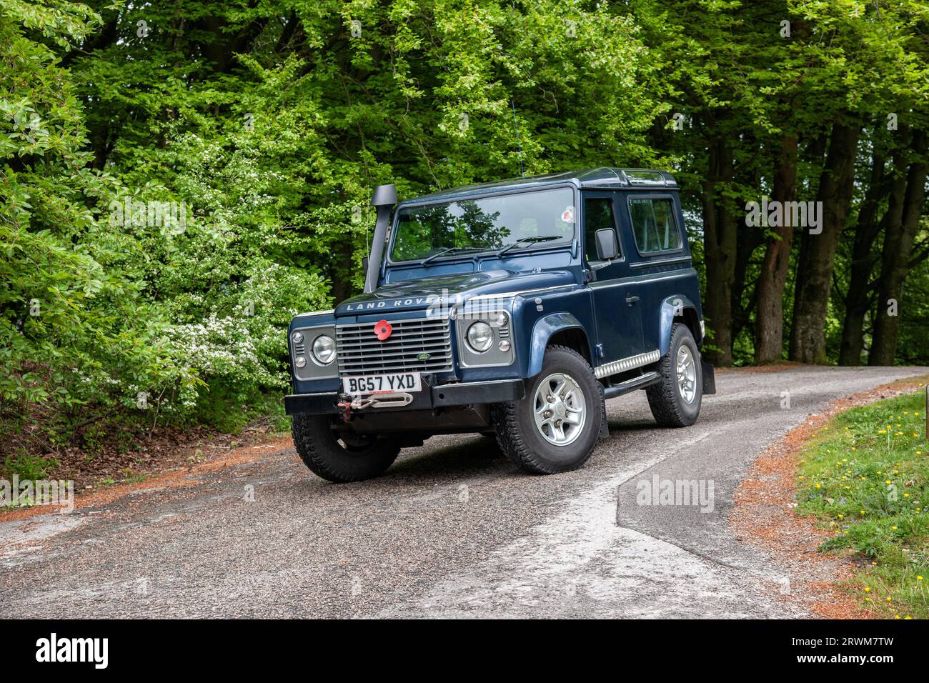 Blue Land Rover Defender equipped with five-spoke alloy wheels and ...