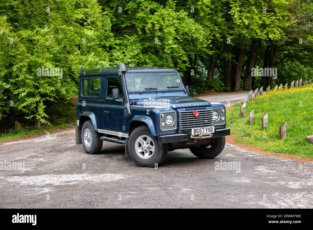 Blue Land Rover Defender equipped with five-spoke alloy wheels and ...