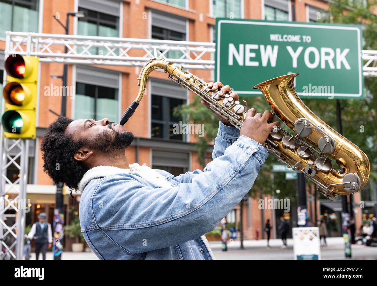 EDITORIAL USE ONLY Saxophonist Clint Sinclair performs at a free ...