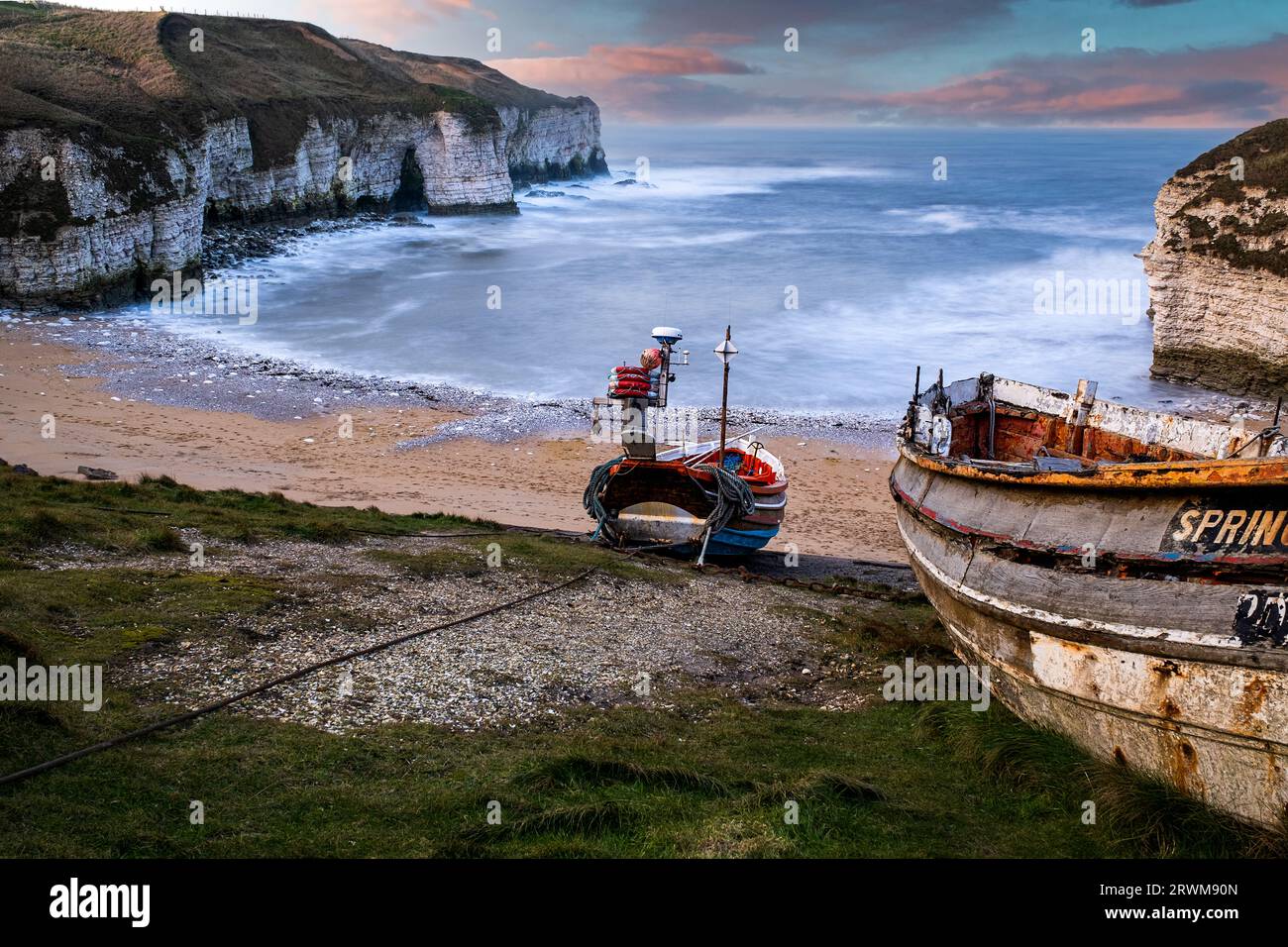 Fishing boats above a beach on the Yorkshire coast at Flamborough and ...