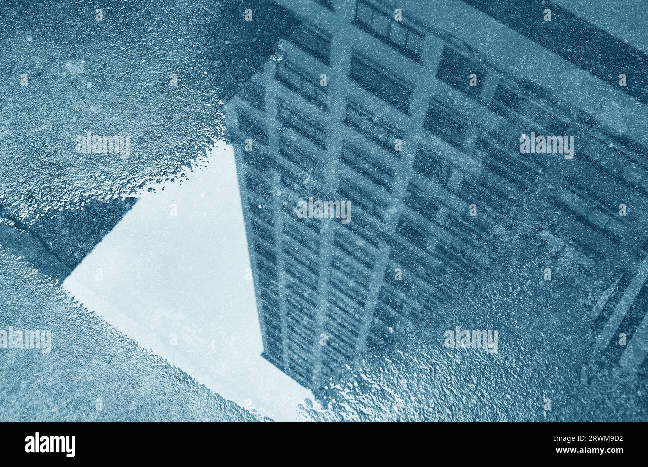 Surreal pop art of high buildings reflecting on the puddle in blue ...
