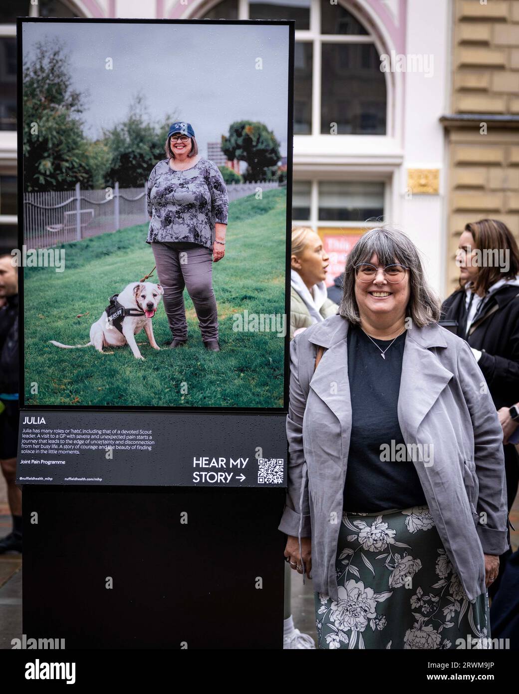 EDITORIAL USE ONLY Julia Dutton stands with her portrait at the opening ...