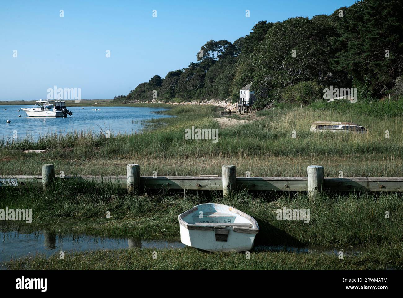 Coastal fishing shack and boats Stock Photo - Alamy