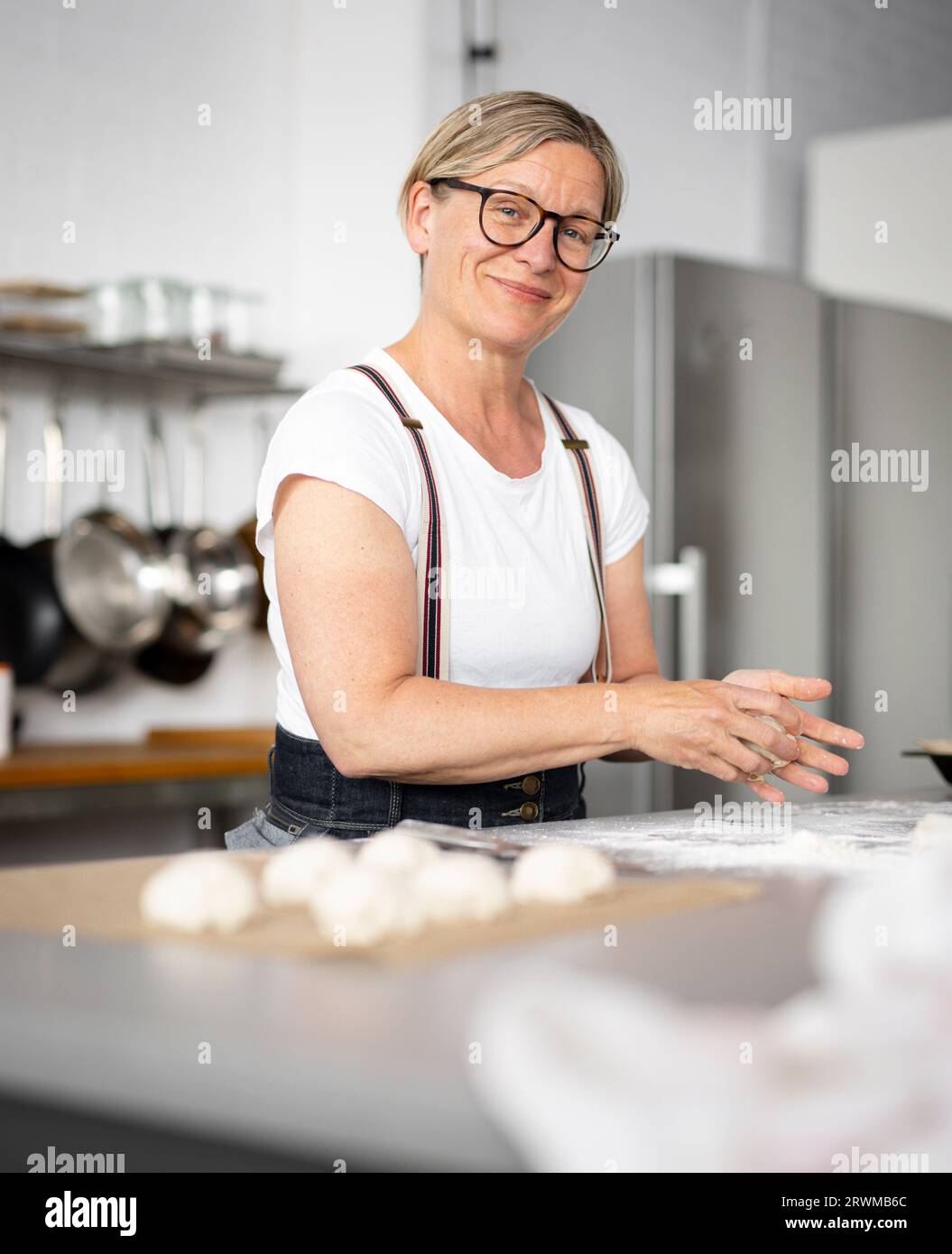Cheerful baker stands hi-res stock photography and images - Alamy