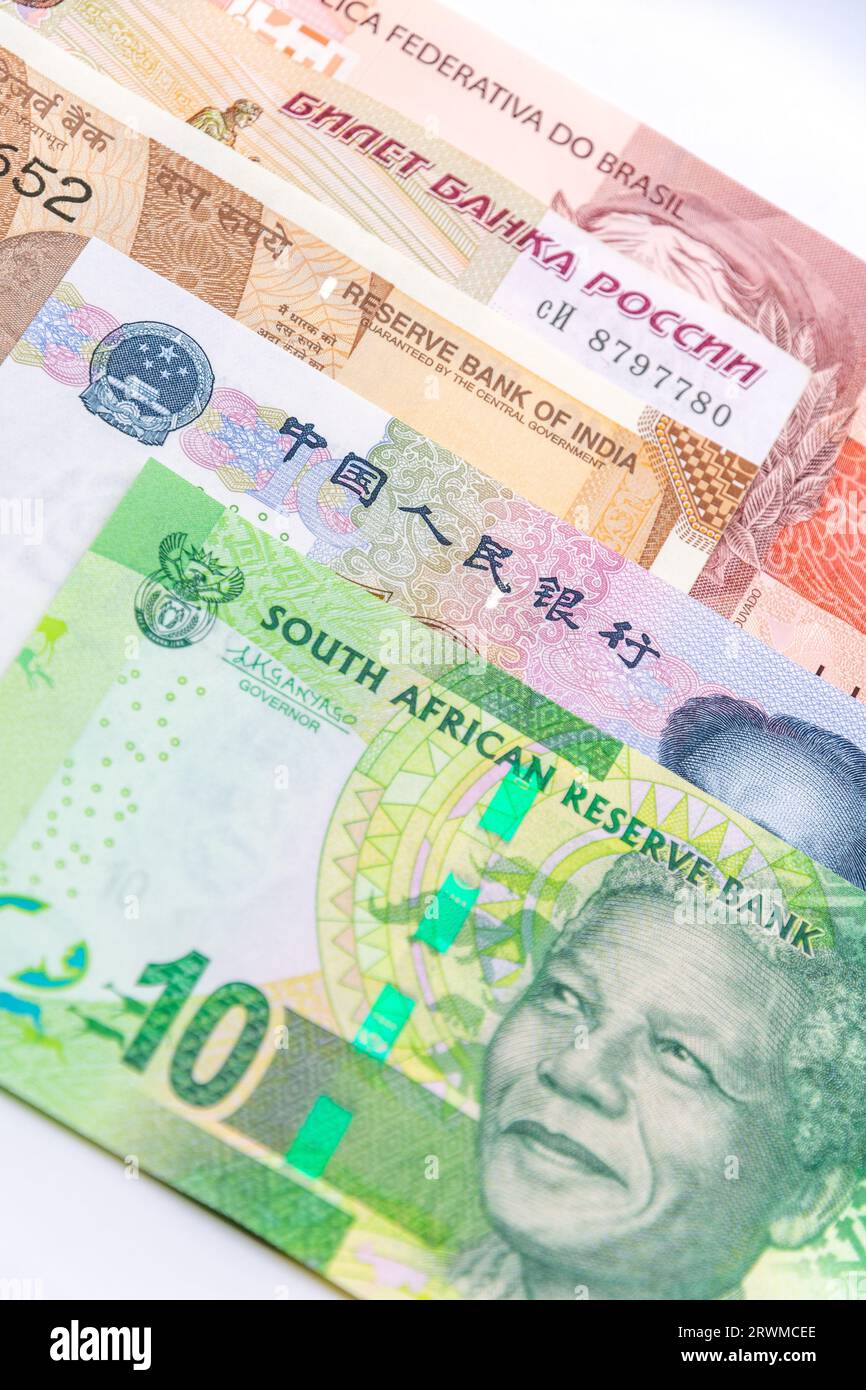 A closeup of BRICS countries' banknotes on a stack Stock Photo - Alamy