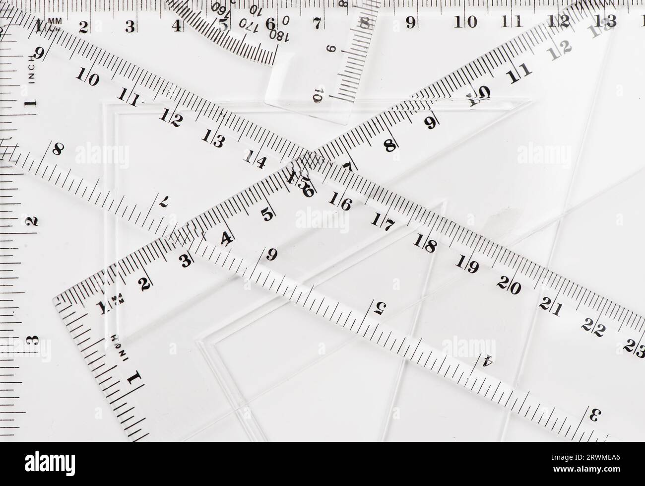 school background with set of transparent rulers on white background ...